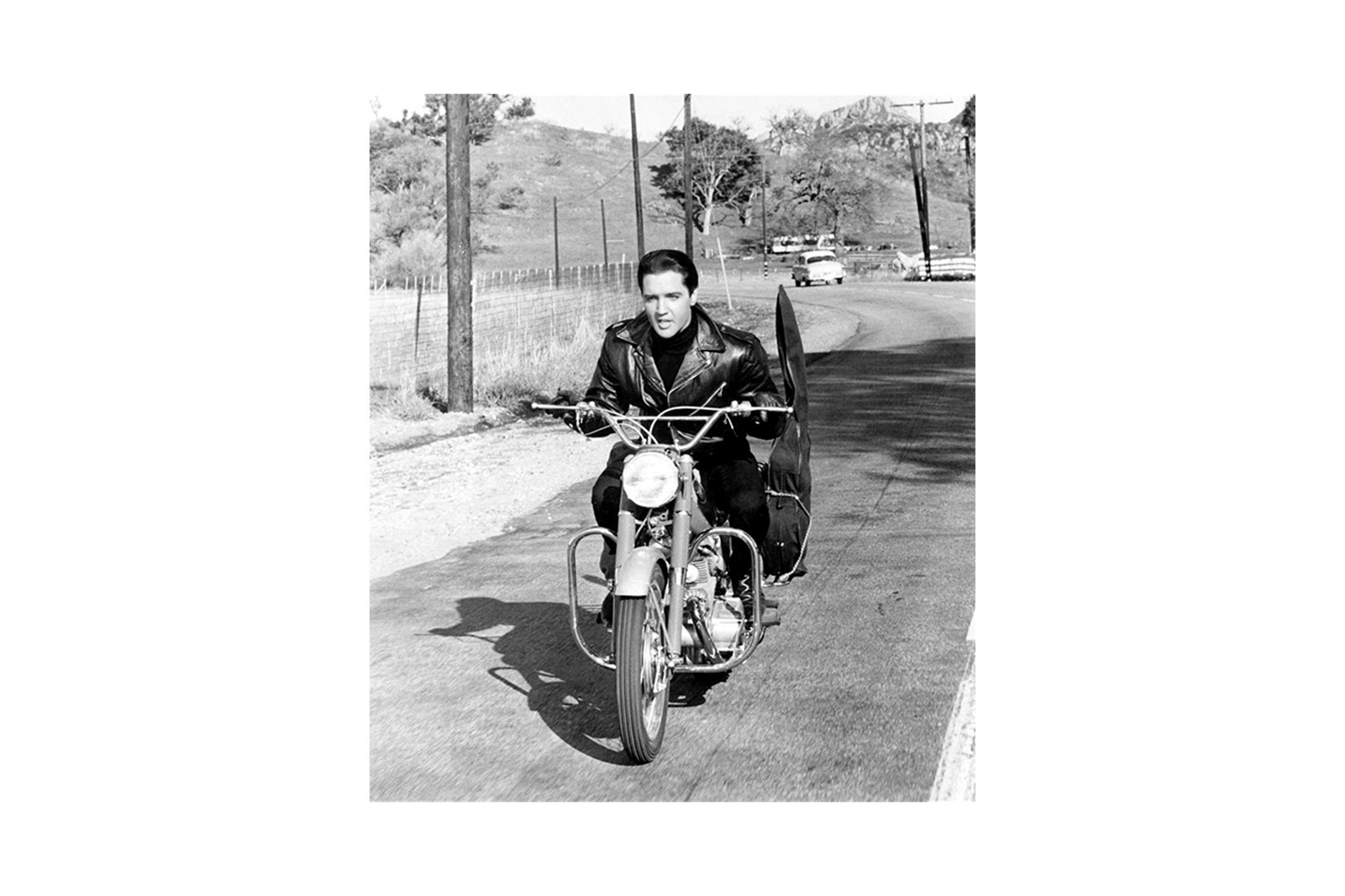 Lot 203 - 'Elvis Presley on his Honda Motorcycle',